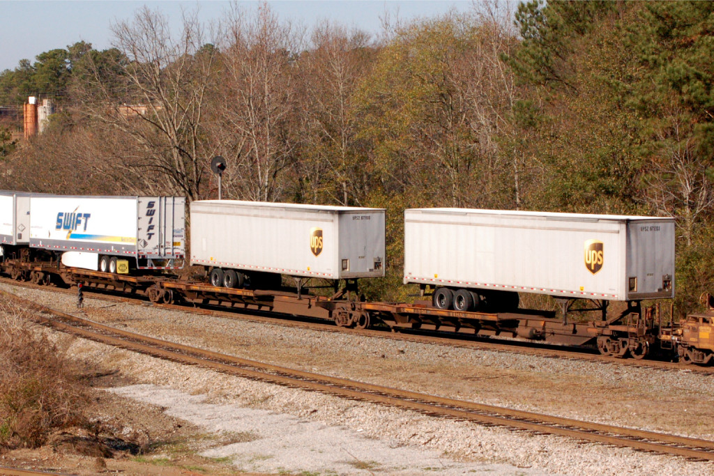 Trailer Train spine car TTHX #360106 with conventional trailers UPSZ #871203, UPSZ #871106 ...